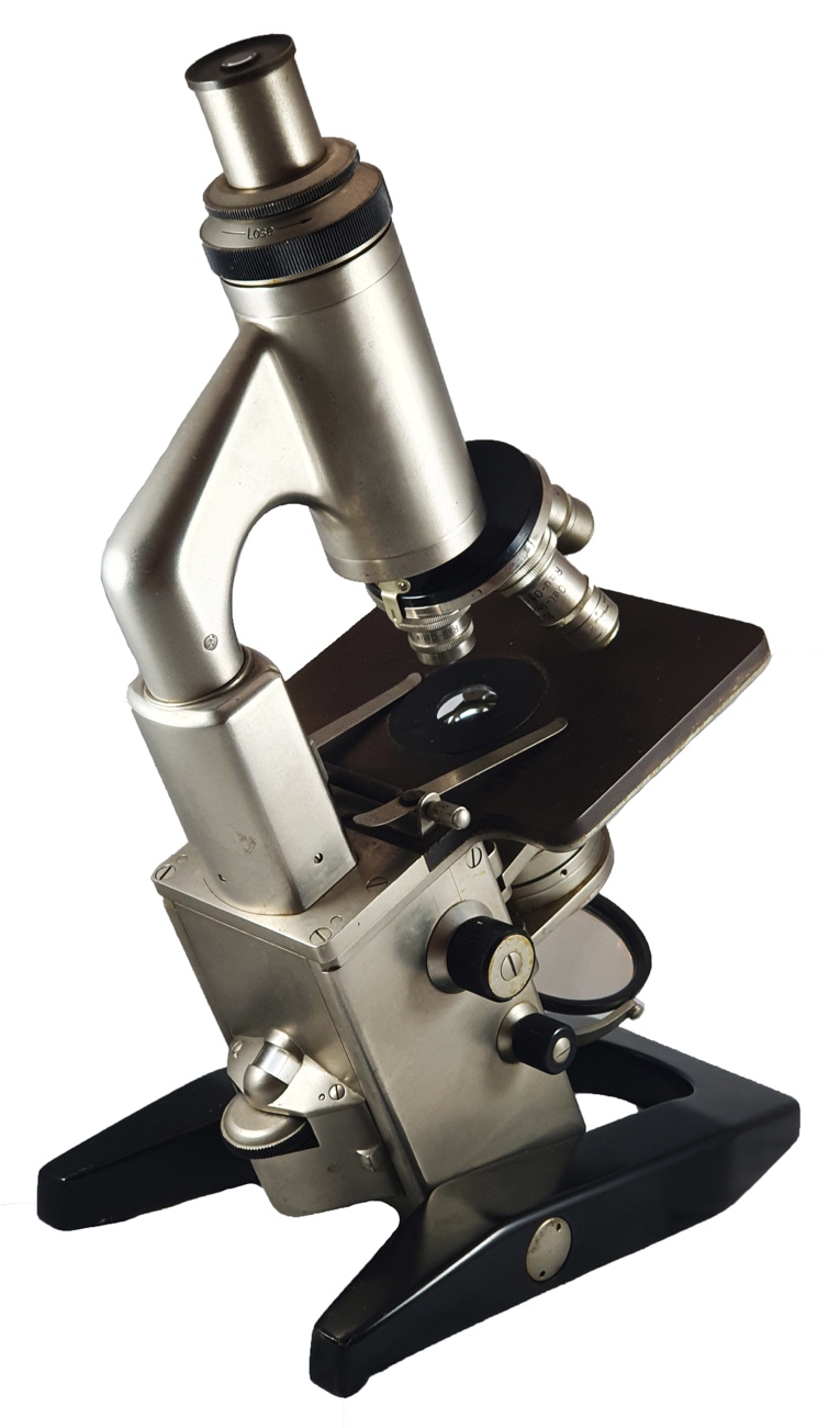 A picture containing object, indoor, microscope, tableDescription ...